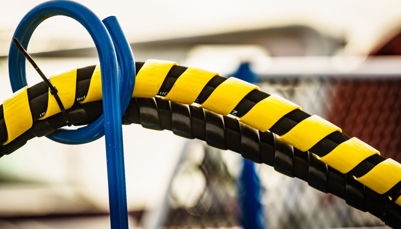 Hose Protection: Spiral Guard or Wrap Sleeve? | Python Covers